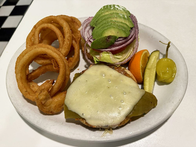 When onion rings achieve perfect circularity and burgers wear their avocado like emerald crowns, you know you've found diner royalty.