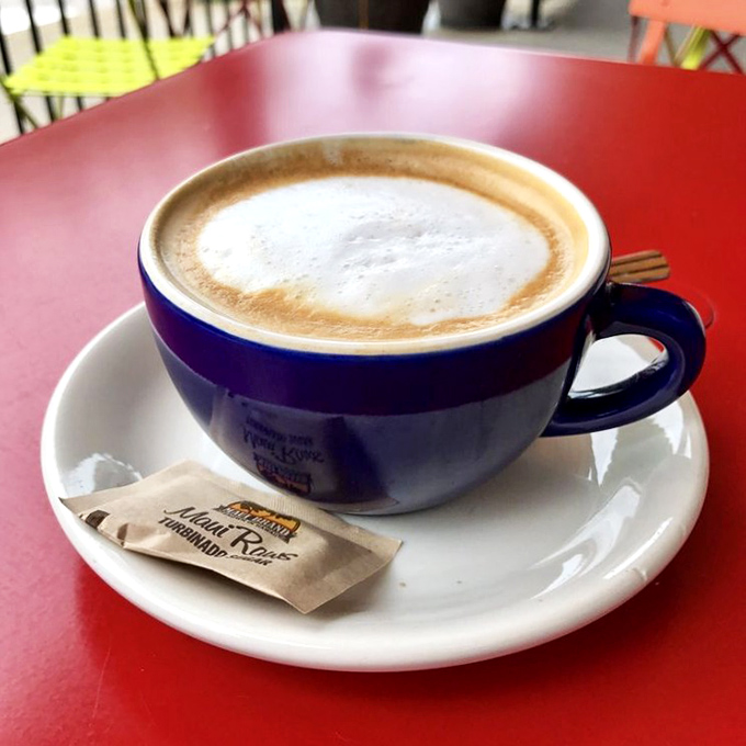 Coffee served European-style: smaller portion, bigger flavor, in a blue ceramic cup that feels like it has stories to tell.