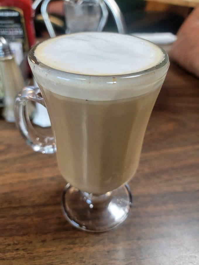 This isn't just a latte—it's a frothy meditation in a glass mug, offering warmth and caffeine with a side of contemplation.