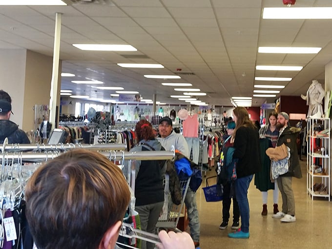 The thrifting journey's final chapter&mdash;where shoppers gather with their discoveries, each cart telling a different treasure-hunting tale.