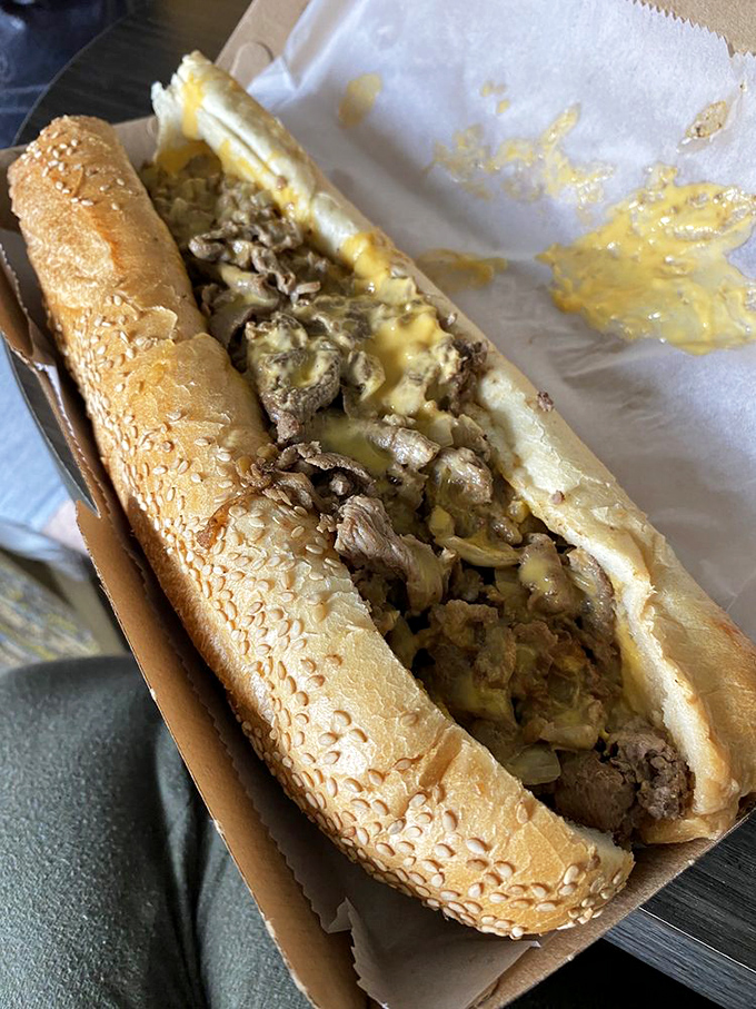 A cheesesteak that's worth traveling for. The yellow cheese rivulets tell you everything you need to know about its greatness.