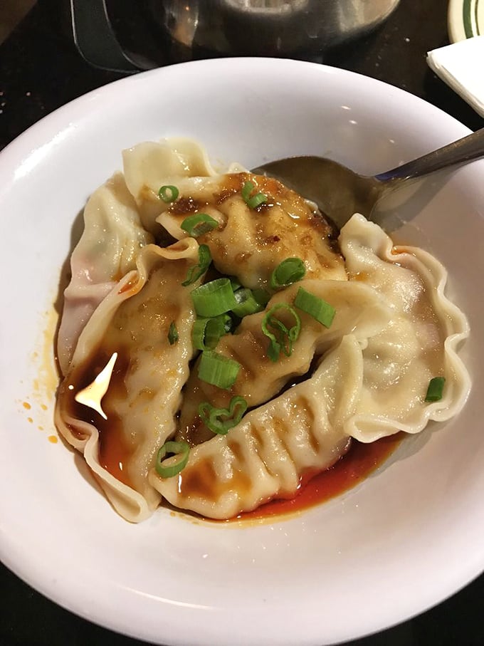 Dumplings so plump and juicy they look like they're about to whisper secrets of perfect pleating and delicate dough-to-filling ratios.