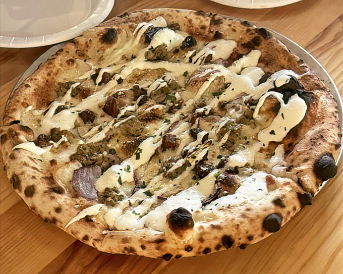 When mushrooms and cheese unite on a perfectly charred crust, it's not just dinner&mdash;it's a religious experience.