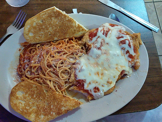 When spaghetti meets garlic toast and melted cheese, it's not just Italian-American cuisine&mdash;it's a beautiful carb collaboration that works.
