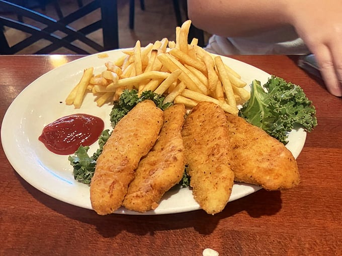Golden-fried chicken tenders that achieve that perfect balance&mdash;crispy exterior giving way to juicy interior&mdash;with fries that could steal the show on their own.