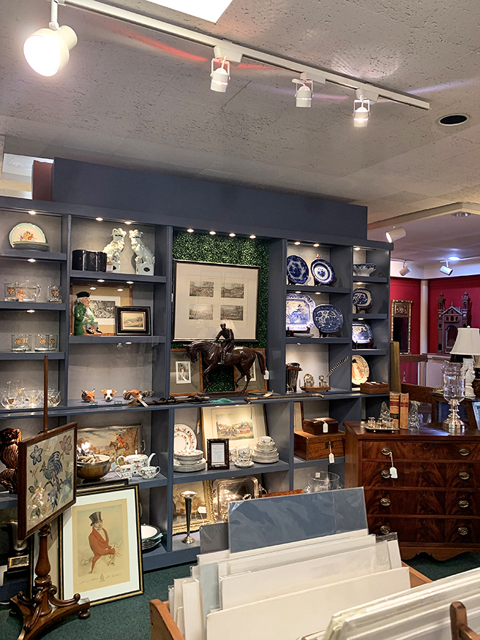 Blue-gray shelving creates the perfect backdrop for this curated chaos of porcelain, paintings, and equestrian treasures&mdash;Middleburg's passions on elegant display.