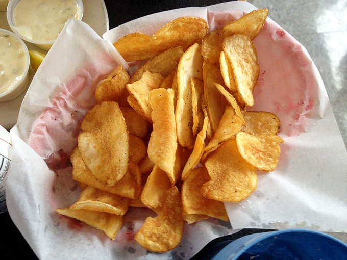 These aren't just chips—they're potato slices that went to finishing school. Crispy, golden, and ready to be the perfect delivery vehicle for tartar sauce.