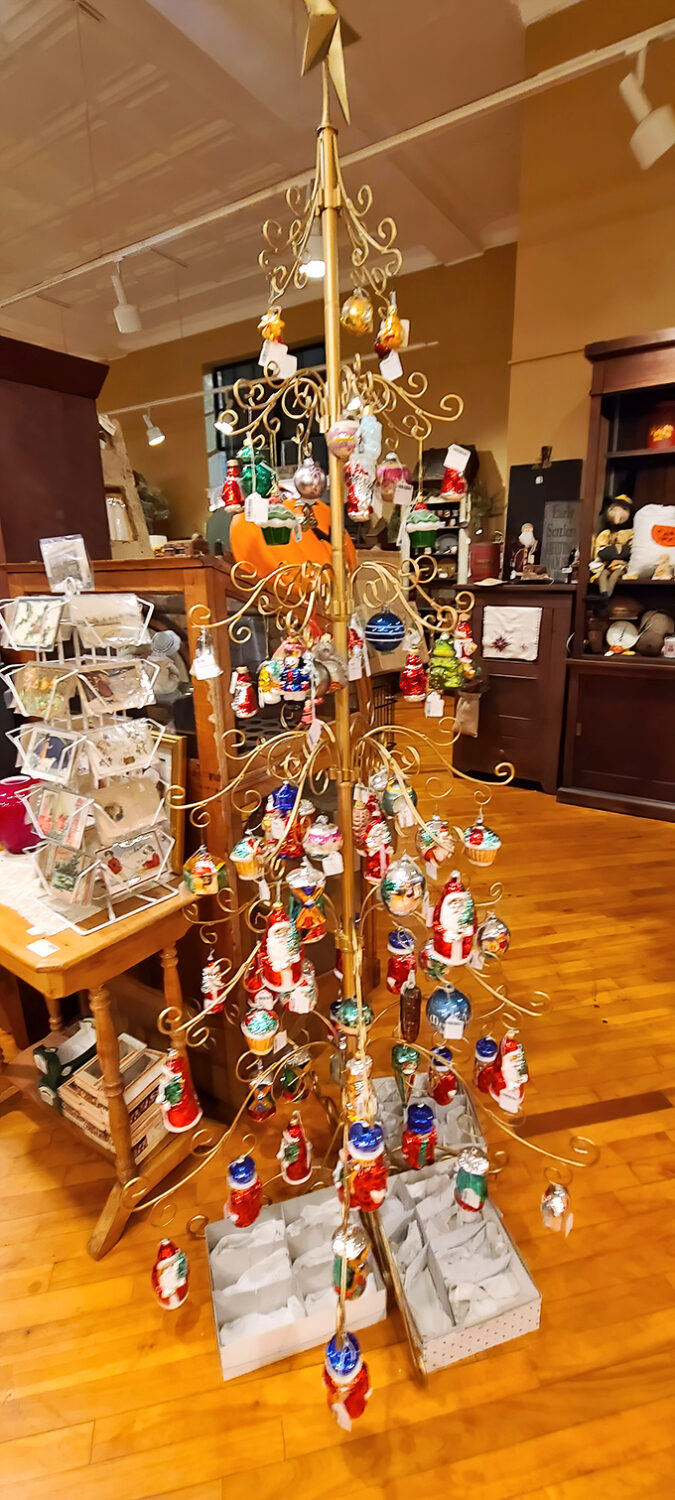 This golden Christmas tree drips with vintage ornaments, a metallic memory-keeper of holidays past that puts your artificial spruce to shame.