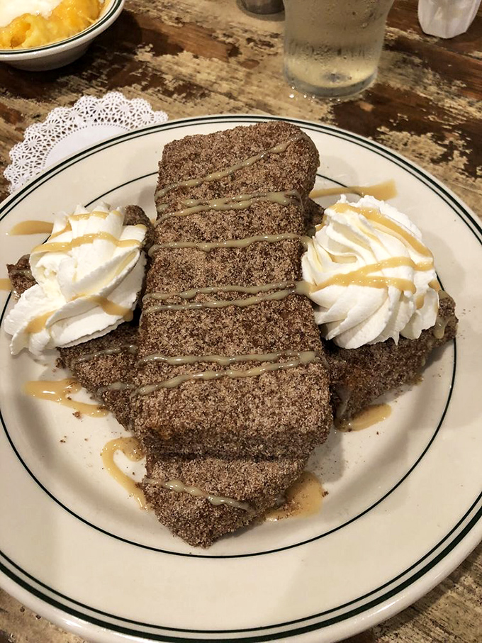 Not all French toast is created equal—this cinnamon-sugar coated version with whipped cream has clearly overachieved.