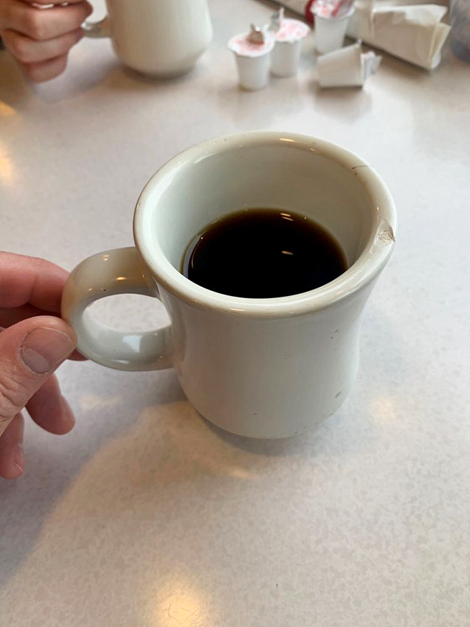 The diner coffee mug&mdash;small but mighty, ready to transform morning zombies into functioning humans one sip at a time.