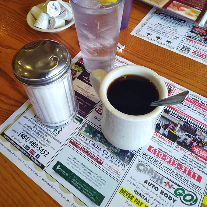 The holy trinity of diner essentials: hot coffee, cold water, and a sugar shaker&mdash;simple pleasures that make everything right with the world.