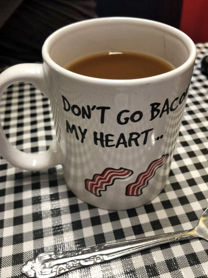 "Don't go bacon my heart"—the mug says it all. In diners like this, coffee comes with a side of personality.