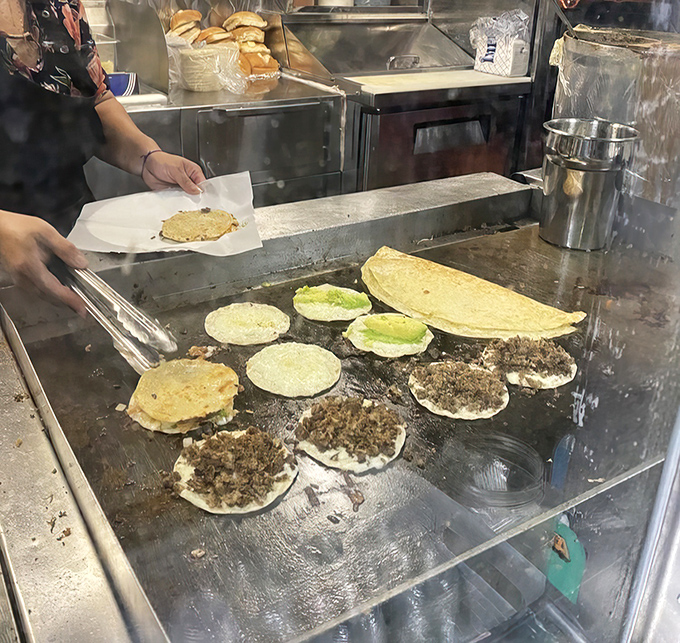 The choreography of the flat-top grill, where tortillas dance with meat in a perfectly synchronized ballet of steam, sizzle, and flavor-building.