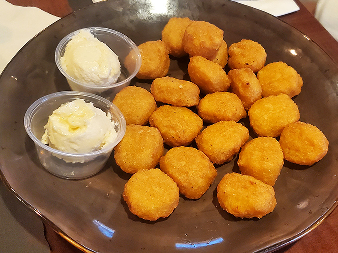 Golden corn nuggets with dipping sauces—proof that Wisconsin knows comfort food isn't just a category, it's an art form worth mastering.