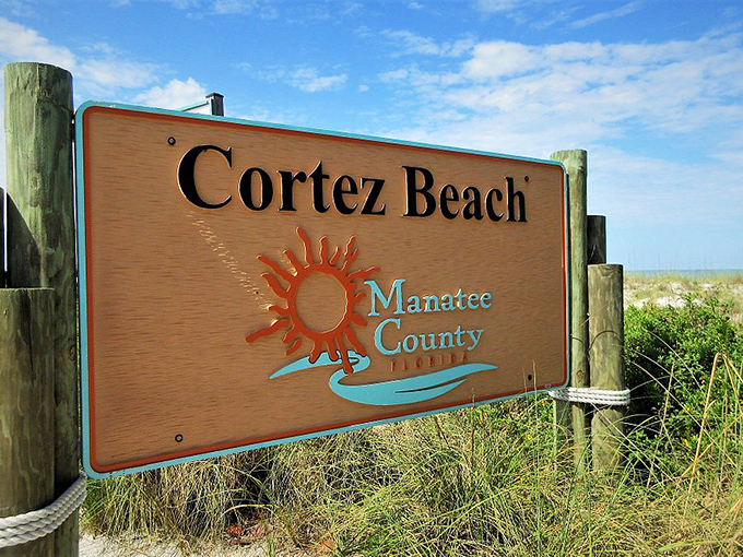 Cortez Beach welcomes visitors with a sign that might as well add: "No high-rises blocking your sunset views or your vitamin D intake."