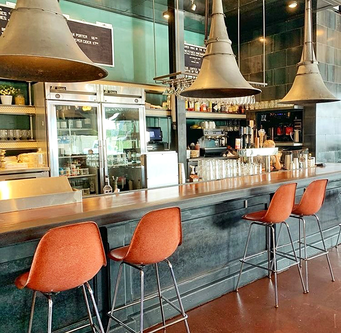 Bar seating: where solo diners become regulars and regulars become family. Those copper pendant lights have witnessed countless food epiphanies.