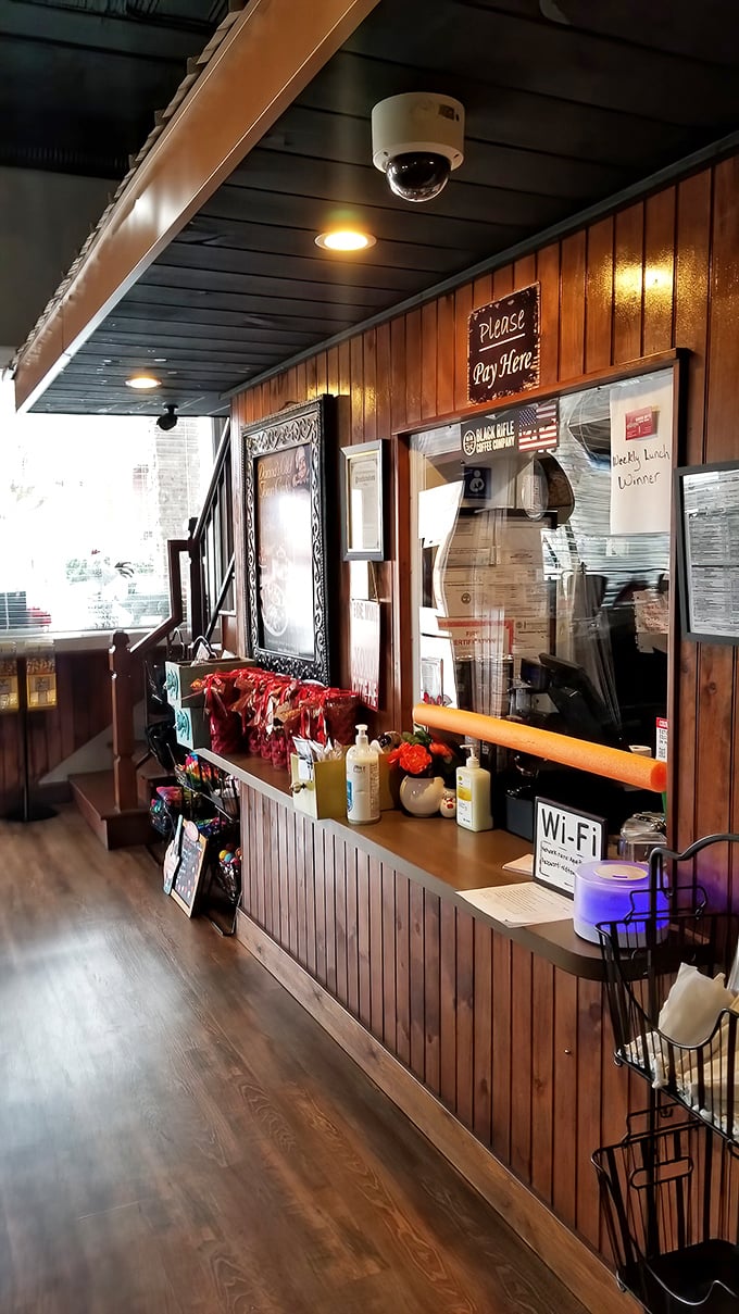 The heart of operations where magic happens. That "Please Pay Here" sign has witnessed countless satisfied smiles and loosened belts.