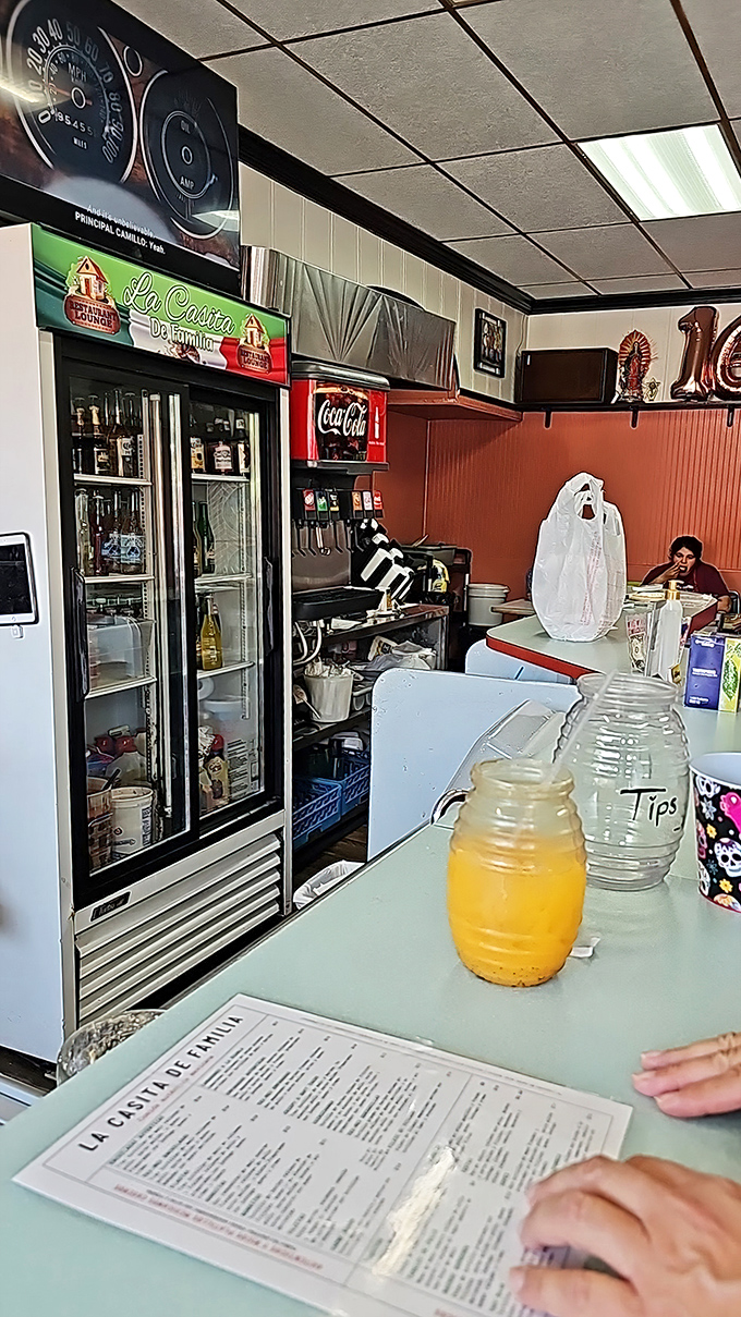 The drink cooler stands ready like a refreshment sentinel. That orange jarrito is practically begging to join your meal.