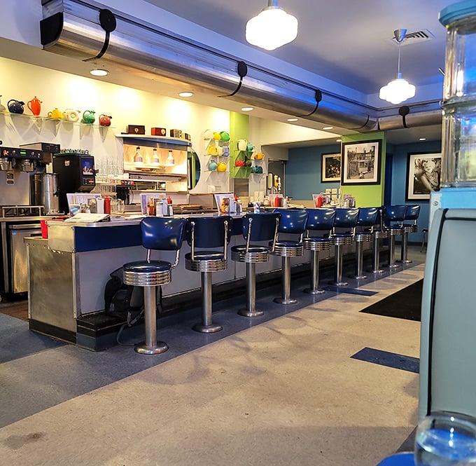 The counter seating offers front-row tickets to the culinary show, where blue stools have witnessed countless first dates, business deals, and food epiphanies.
