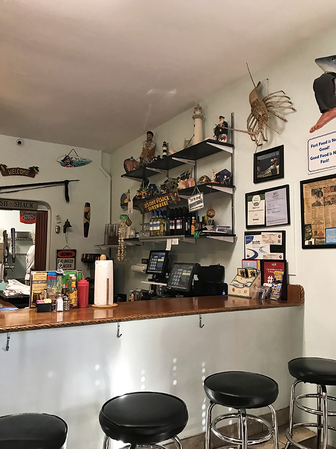Every great seafood joint needs a counter with maritime knickknacks. This one says, "The captain's been collecting treasures for decades."