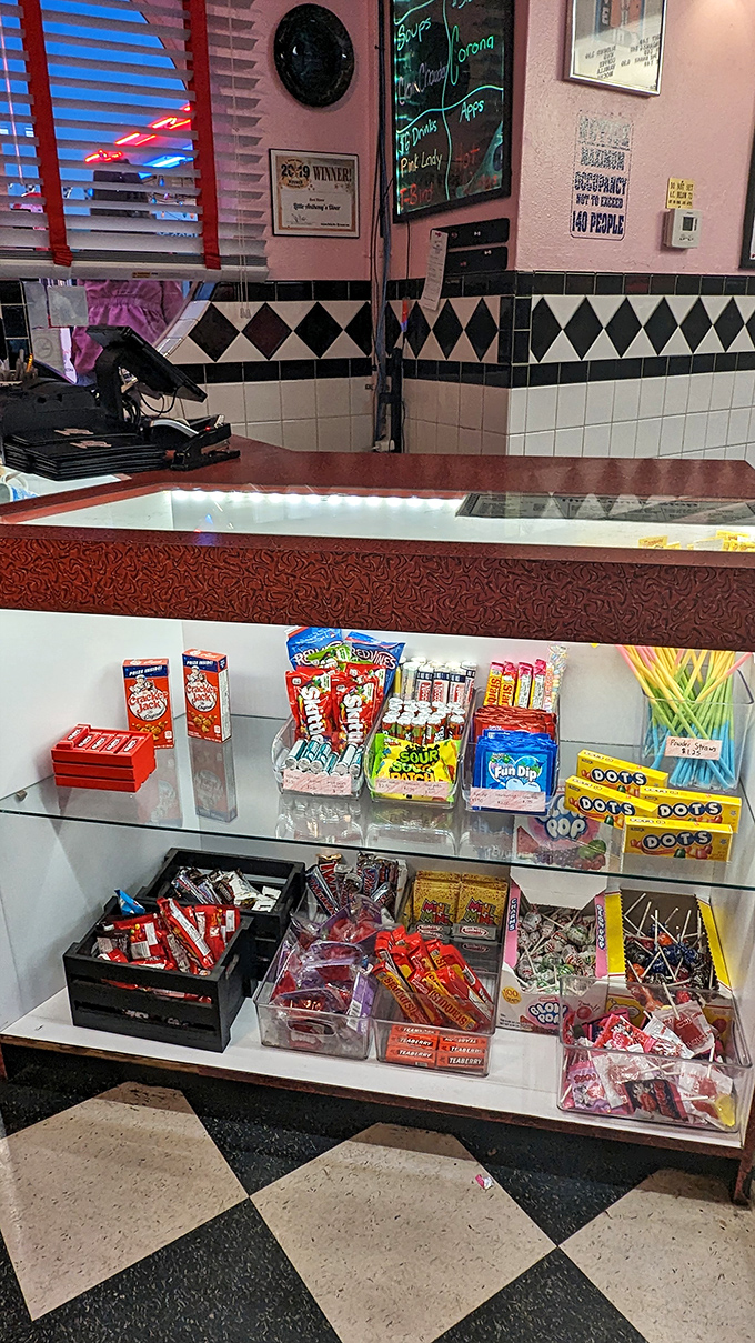 The counter display of nostalgic candies would make Willy Wonka jealous. From Dots to Fun Dip, childhood favorites await.