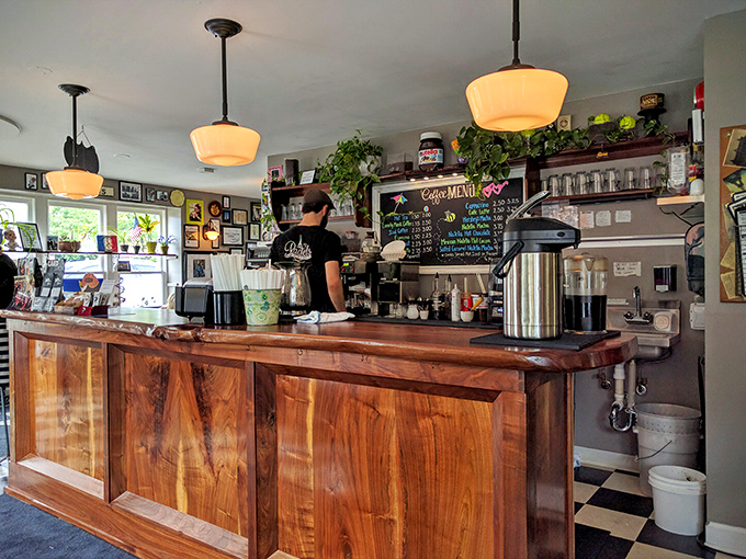 Behind this wooden counter, magic happens. The barista station is where coffee dreams come true while you wait for your crepe masterpiece.