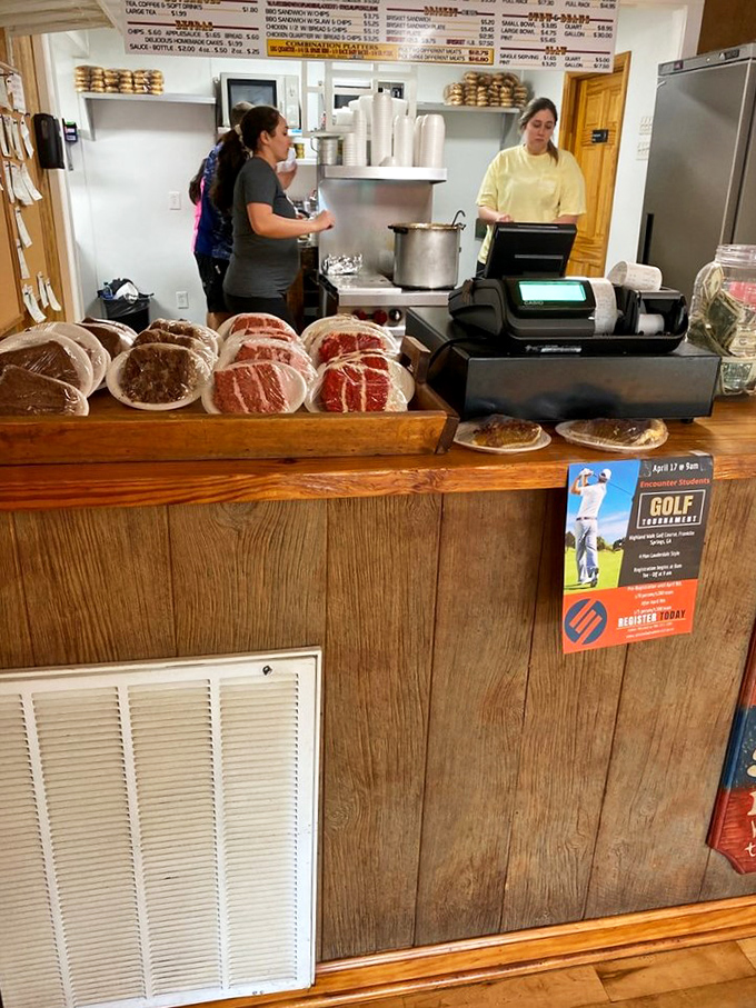 The counter where barbecue dreams come true&mdash;raw meat transformed into smoky perfection by people who understand the sacred art of patience.