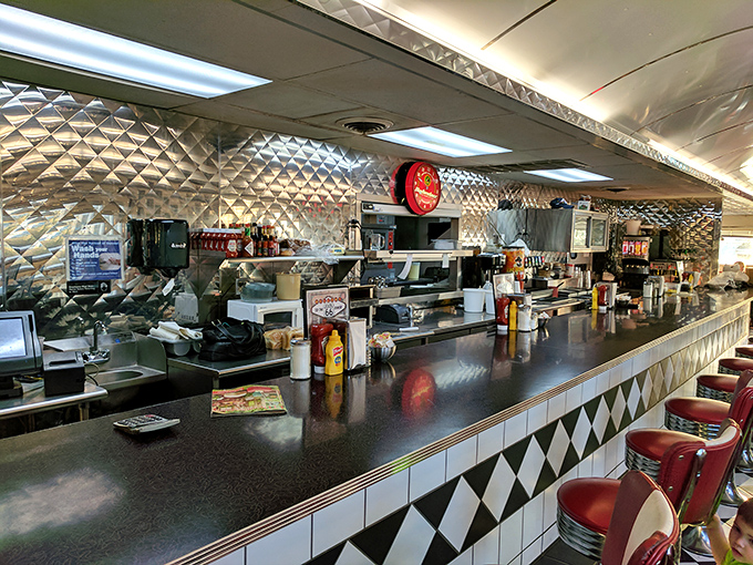 That counter isn't just for eating&mdash;it's front-row seating to the short-order ballet. Watch the magic happen while perched on those fire-engine red stools.