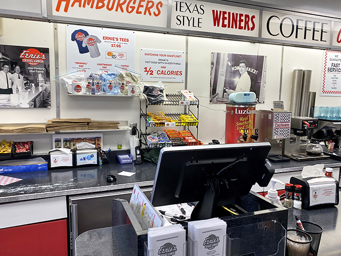 Signs announcing "HAMBURGERS," "WEINERS," and "COFFEE" in bold letters—because sometimes the simplest promises are the most satisfying ones.