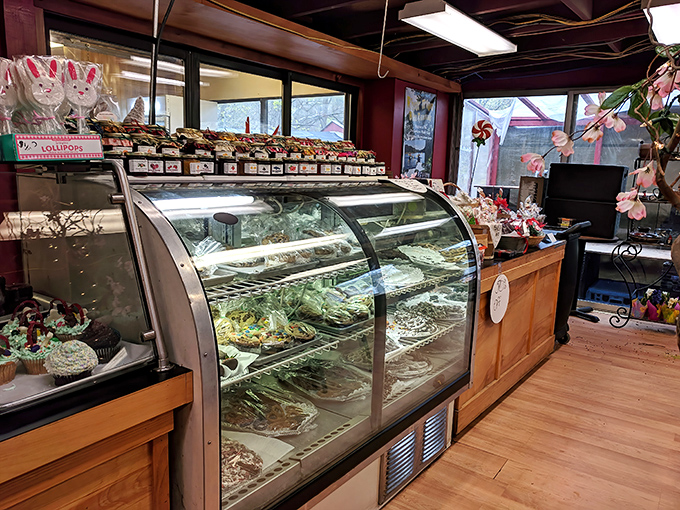 Display cases that should come with a warning: "May cause spontaneous drooling." Each pastry sits like royalty under the glass.