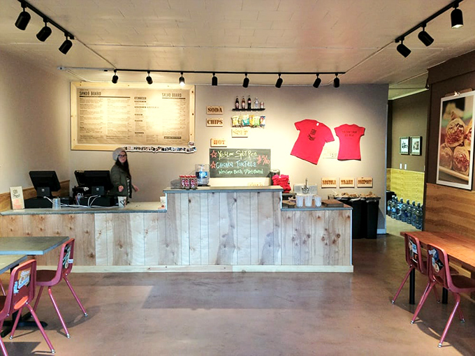 The wooden counter – command central for sandwich operations – where culinary dreams become handheld reality.