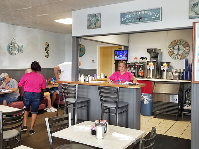 The heart of operations, where orders are called and coffee is always brewing. Those counter seats are prime real estate for solo diners.