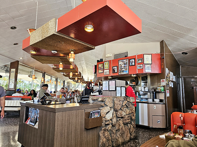 The stone wall and wood paneling create that perfect mid-century warmth. This isn't retro&mdash;it's the real deal that survived while others faded away.