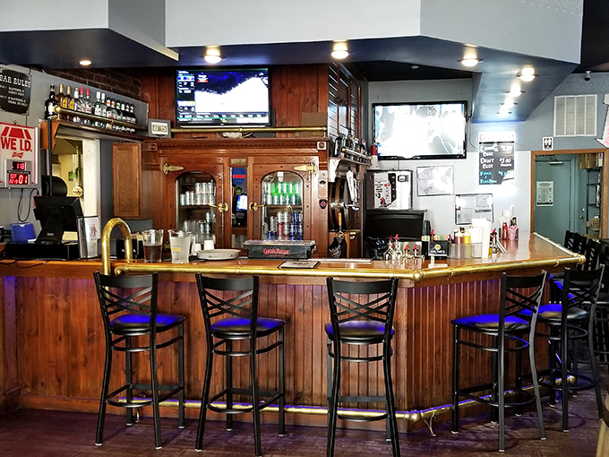 The bar area strikes that perfect balance between "I could watch the game here" and "I could have a meaningful conversation here."