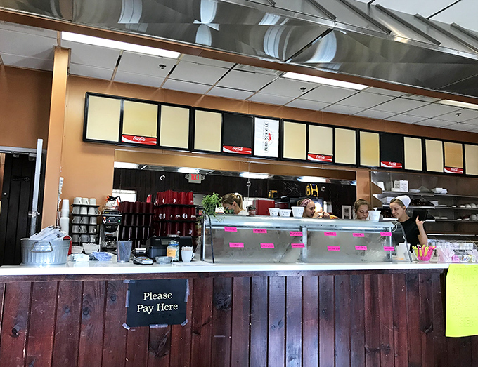 The heart of operations&mdash;where orders are called, coffee is poured, and the magic happens. No pretension, just efficiency with a side of friendliness.