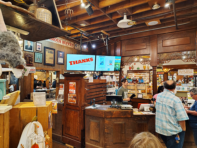 The checkout counter doubles as a time machine, surrounded by vintage memorabilia and the warm wooden tones of genuine Americana.