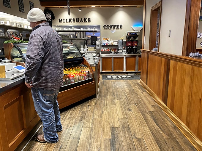 The beating heart of diner culture &ndash; where coffee, conversation, and comfort meet under the watchful eye of "MILKSHAKE" and "COFFEE" signs.