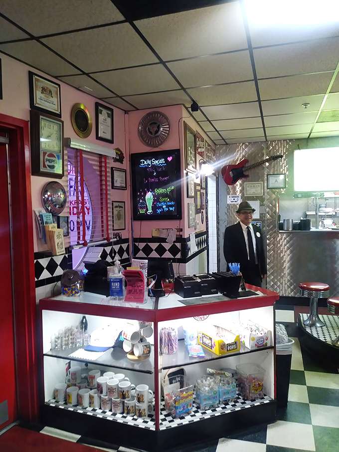 The front counter doesn't just display candy&mdash;it showcases a childhood treasure chest guarded by a bow-tied keeper of sweets.