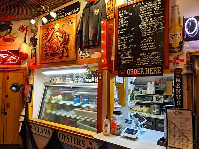 Where nautical meets gastronomical – Tony's order window surrounded by crab art and fishing nets is seafood theater at its finest.