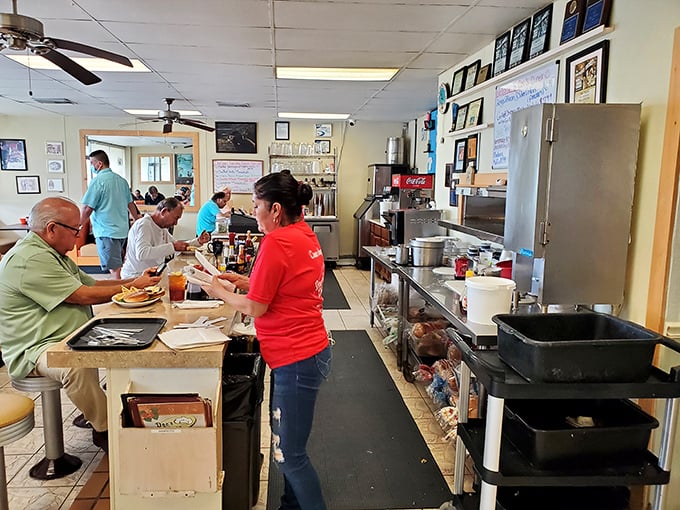 The counter seats offer front-row tickets to the breakfast show, where regulars exchange news while servers perform the daily dance of hospitality.