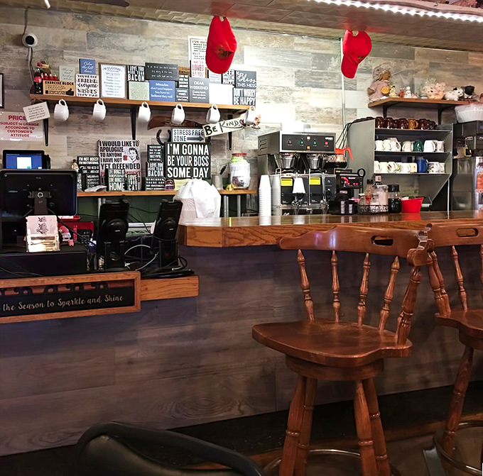 The wall decor reads like a manifesto for living your best life&mdash;with a side order of sass and plenty of wooden accents.