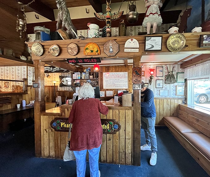 The command center of breakfast operations. This charming wooden counter, adorned with Alpine collectibles, has welcomed hungry travelers for generations.