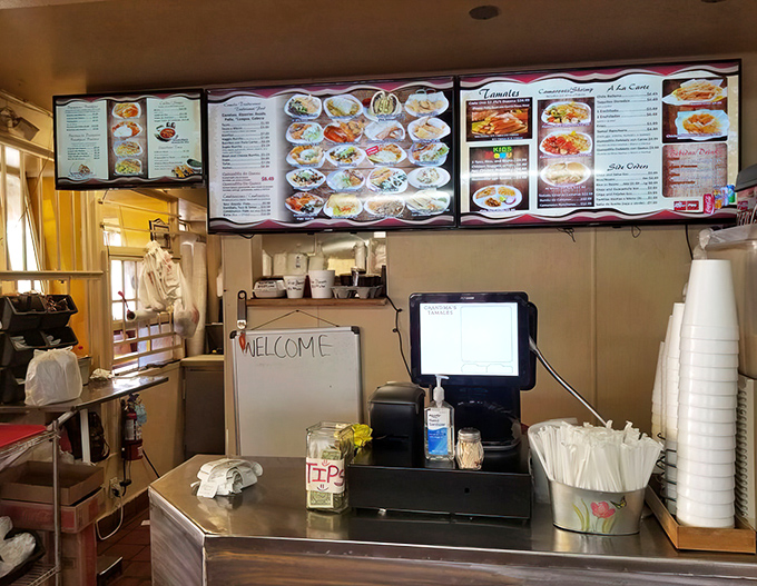 Where the magic happens&mdash;the ordering counter welcomes you with a handwritten "WELCOME" sign. No pretension, just genuine hospitality.