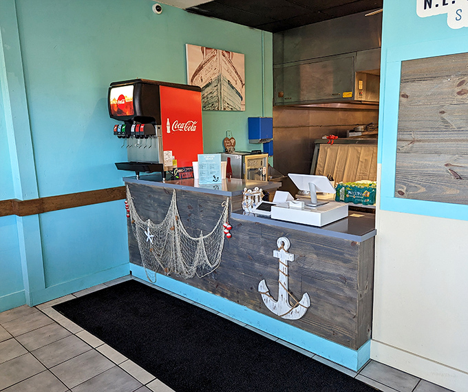 The counter where seafood dreams begin their journey to reality. That anchor isn't just decoration—it's symbolizing how this place will anchor itself in your food memories.