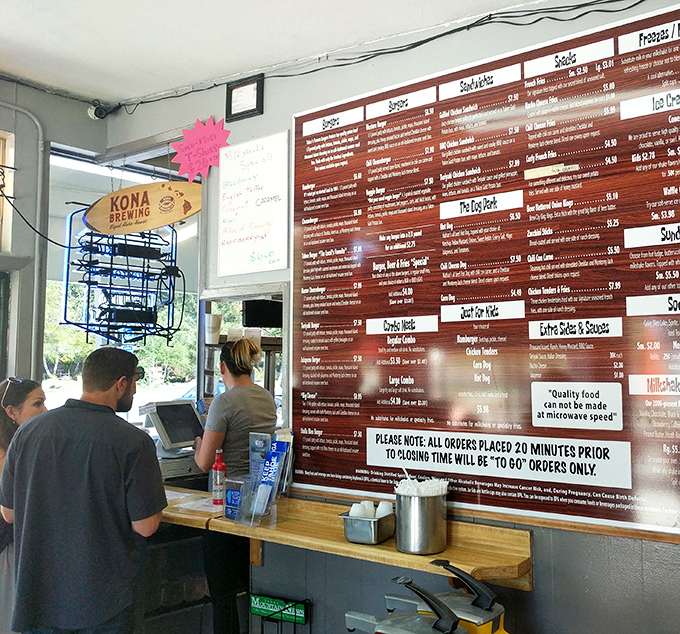 Behind this counter, burger alchemy happens daily&mdash;where ordinary ingredients transform into extraordinary memories under the watchful eye of a Giants pennant.