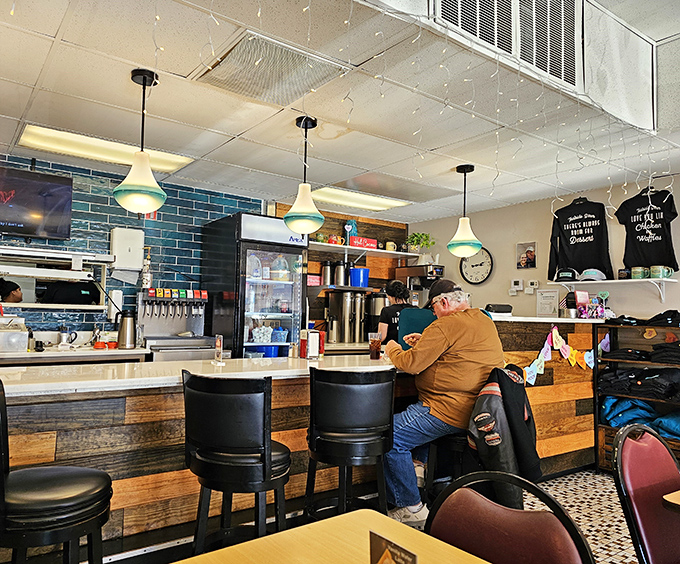 The counter&mdash;where solo diners find community and coffee refills appear like magic. Front-row seats to the breakfast show.