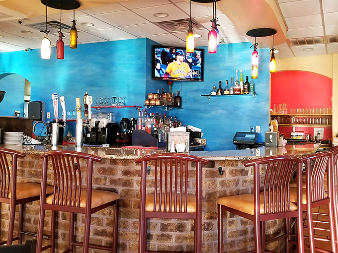 The vibrant blue walls of JoJo's bar area don't just pop visually&mdash;they create the perfect backdrop for that "I can't believe I'm about to eat this well" anticipation.