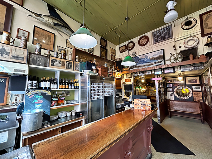 Every inch of wall space tells a maritime story. The bar's weathered wood has heard thousands of toasts and tales.