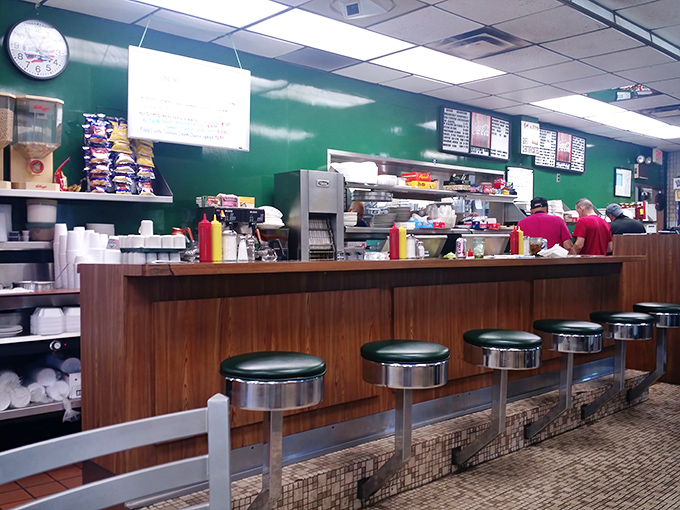 Classic diner counter seating—where solo diners become temporary neighbors and the sizzle of the grill provides the soundtrack to your meal.