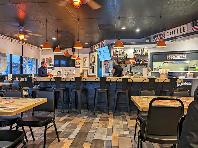 Counter Seats: The diner counter&mdash;democracy's dining room where solo eaters, couples, and regulars all find equal footing under the glow of those signature orange pendant lights.